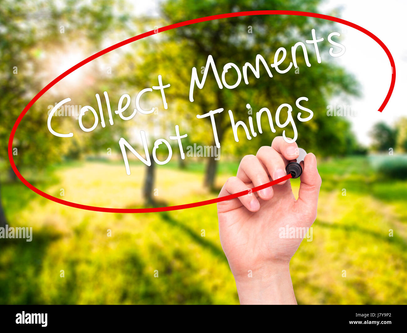Man Hand writing Collect Moments Not Things with black marker on visual ...