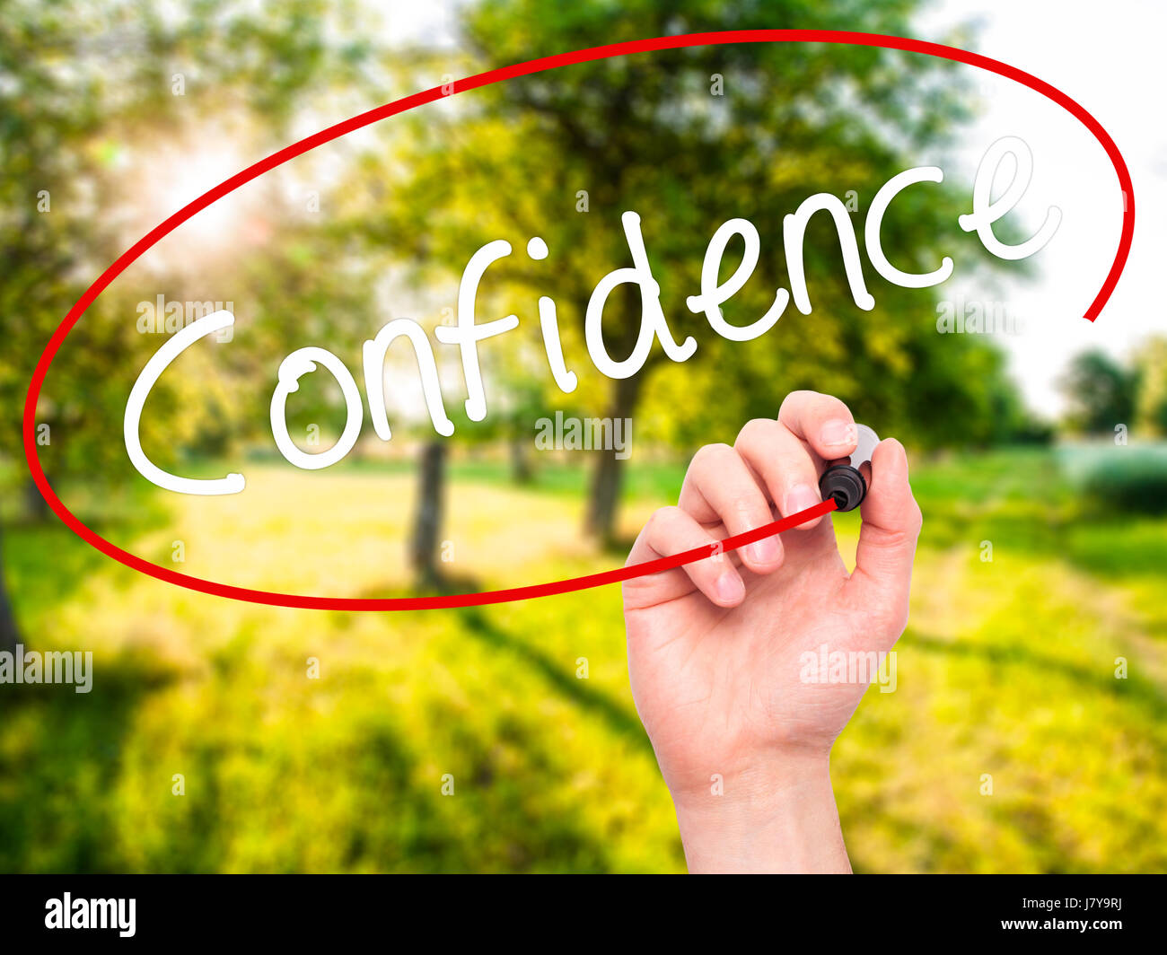 Man Hand writing Confidence with black marker on visual screen ...