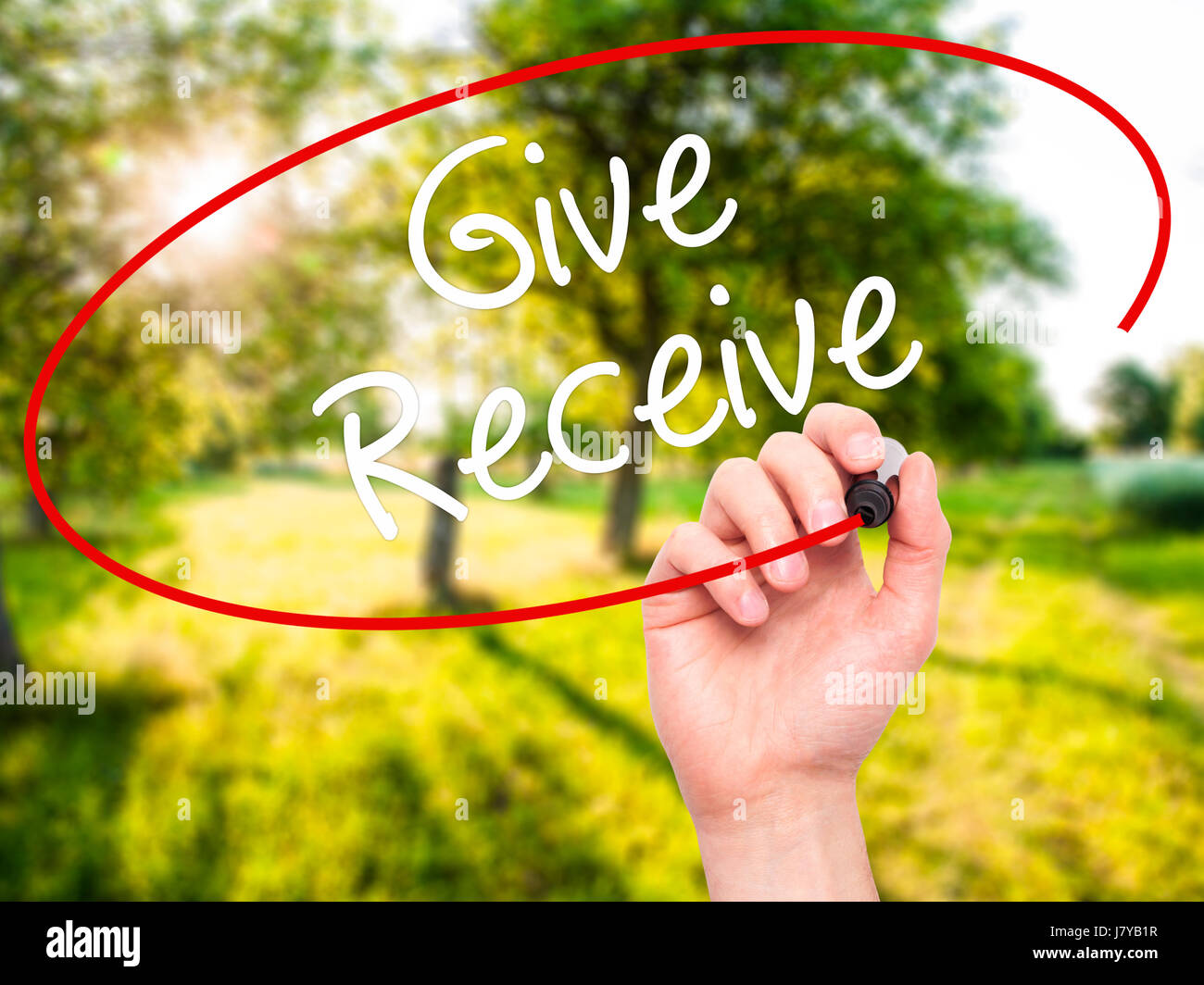 Man Hand writing Give Receive with black marker on visual screen ...