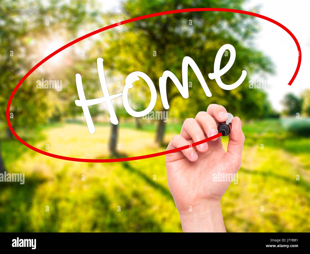 Man Hand writing Home with black marker on visual screen. Isolated on ...