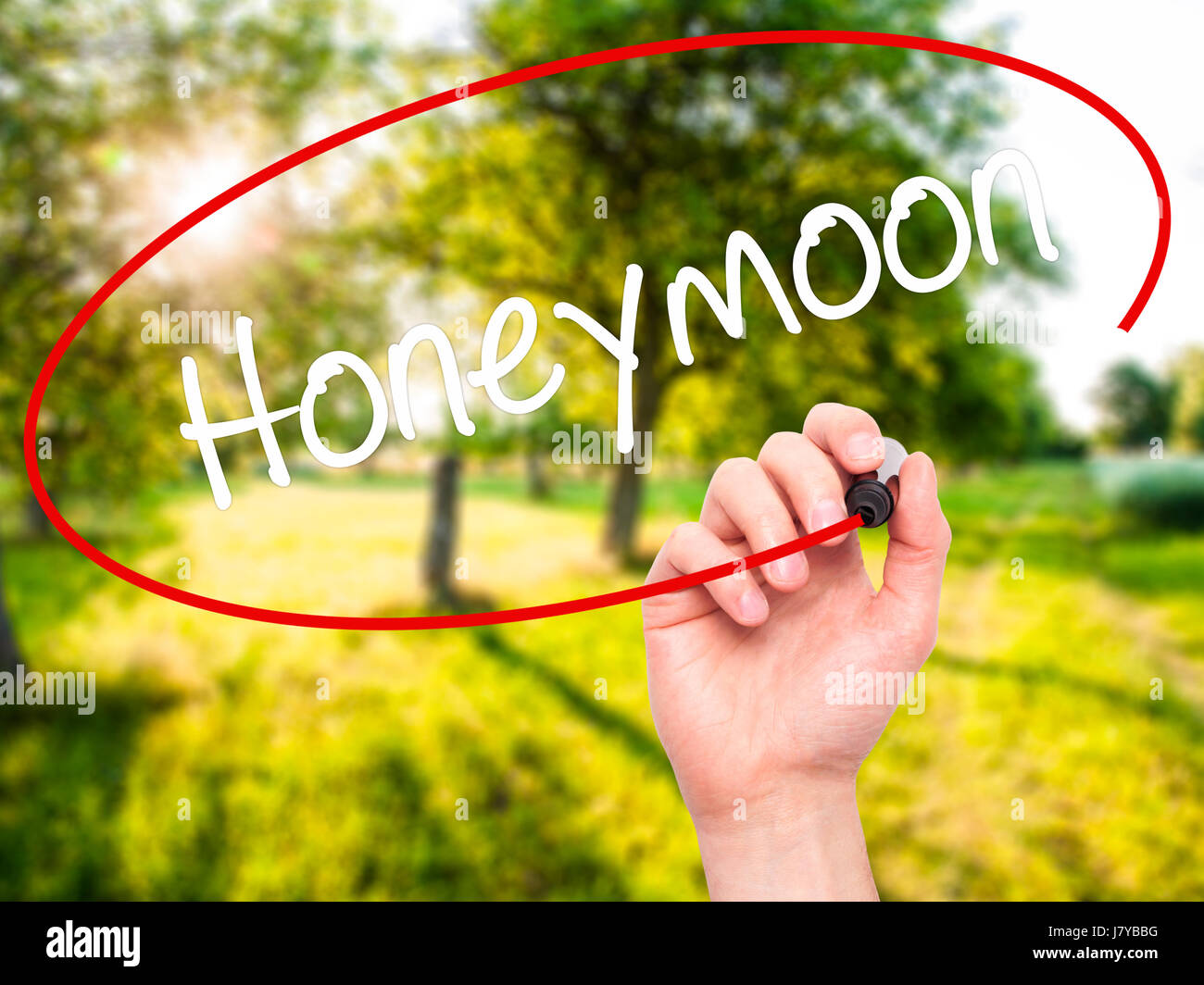 Man Hand writing Honeymoon with black marker on visual screen. Isolated ...