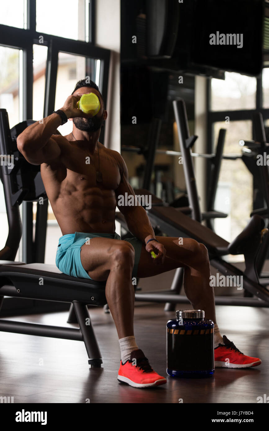 Muscular Man Resting After Exercise And Drinking From Shaker Stock ...