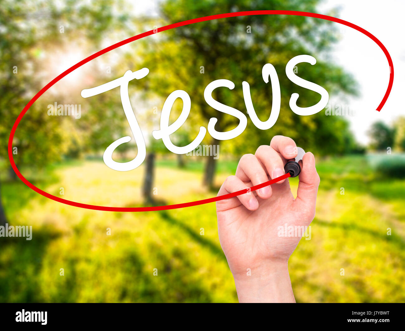 Man Hand writing Jesus with black marker on visual screen. Isolated on ...
