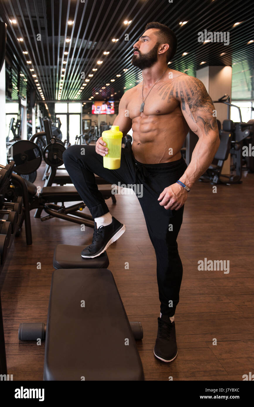 Muscular Man Resting After Exercise And Drinking From Shaker Stock ...