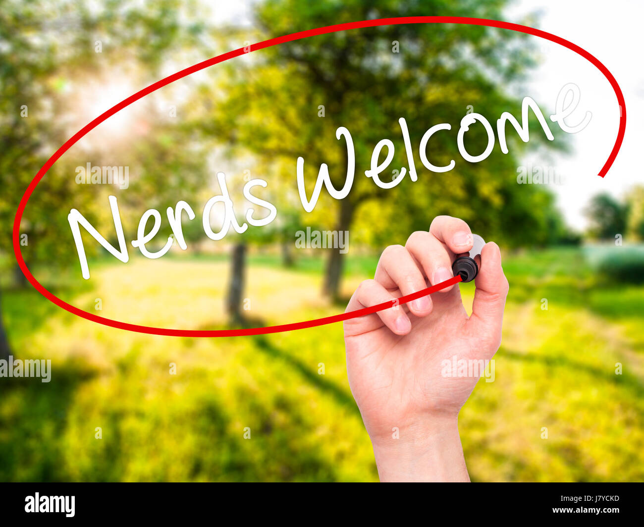 Man Hand writing Nerds Welcome with black marker on visual screen ...