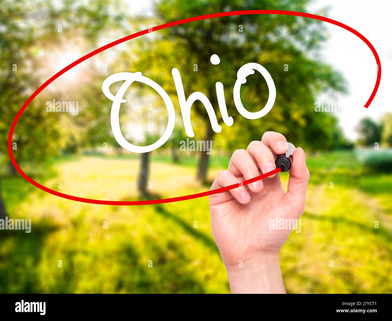 Man Hand writing Ohio with black marker on visual screen. Isolated on ...