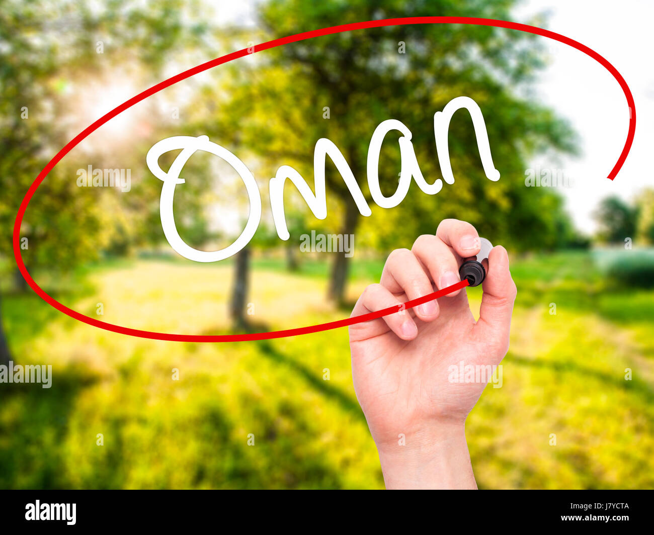 Man Hand writing Oman with black marker on visual screen. Isolated on ...