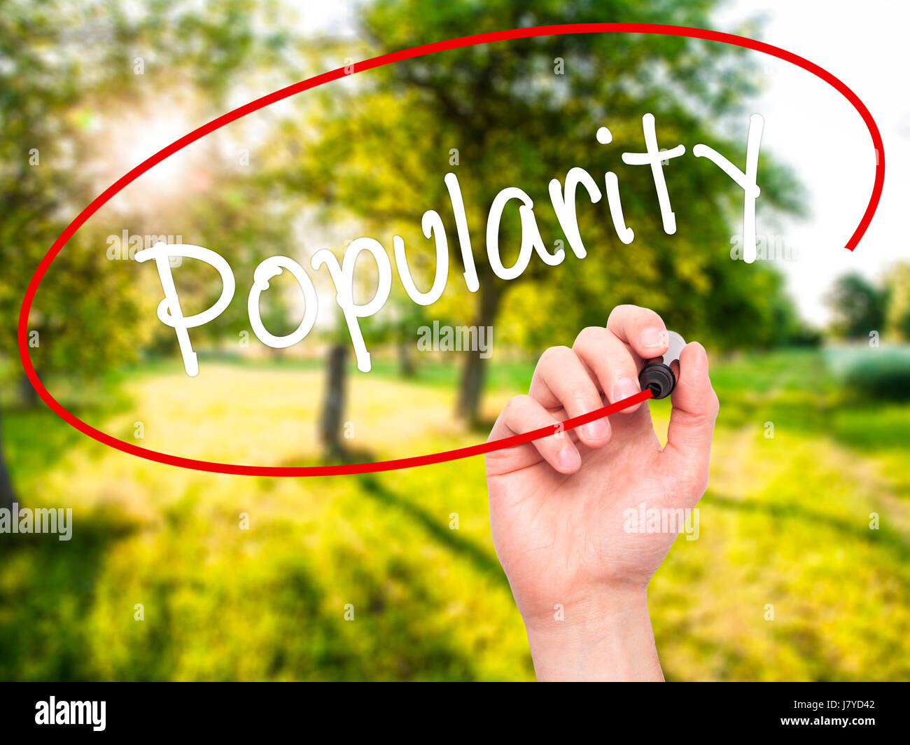 Man Hand writing Popularity with black marker on visual screen ...