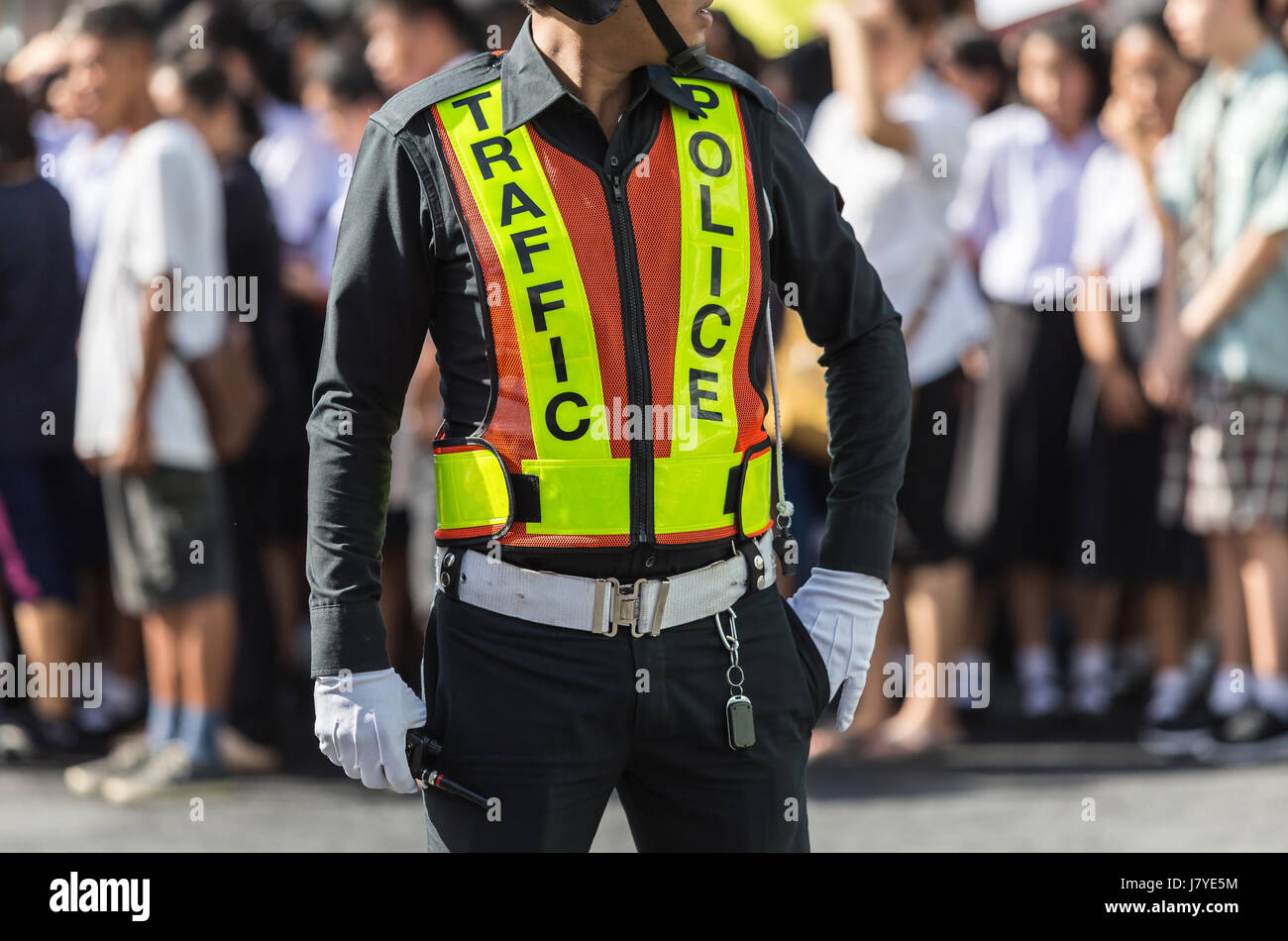 Traffic police standing on the road while doing his work Stock Photo ...