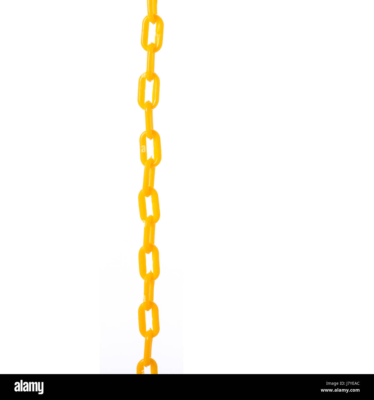 New yellow plastic chain. Studio shot isolated on white background ...