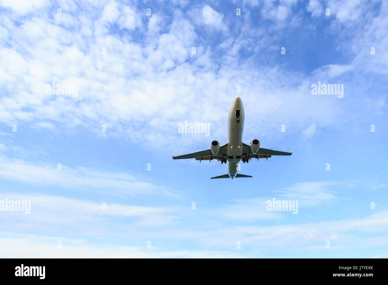 Airplane flying under blue sky and white cloud in Phuket, Thailand ...