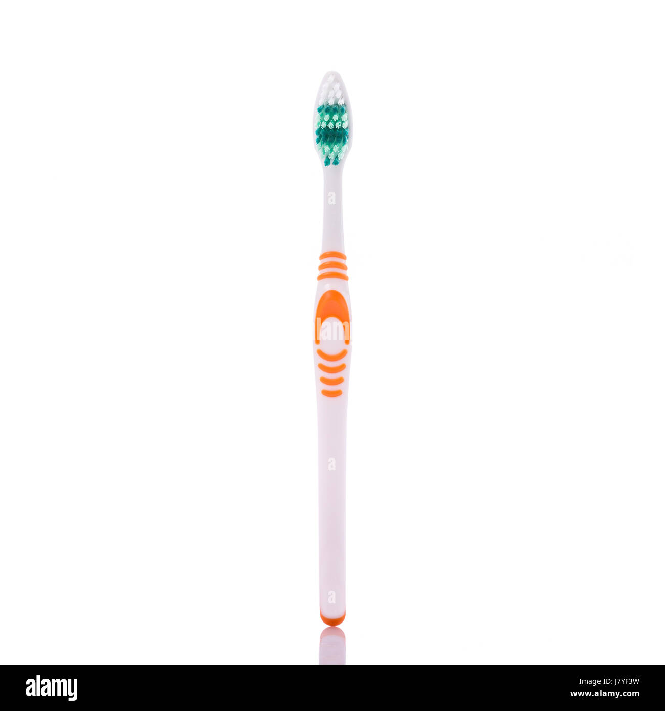 New orange toothbrush. Studio shot isolated on white background Stock ...