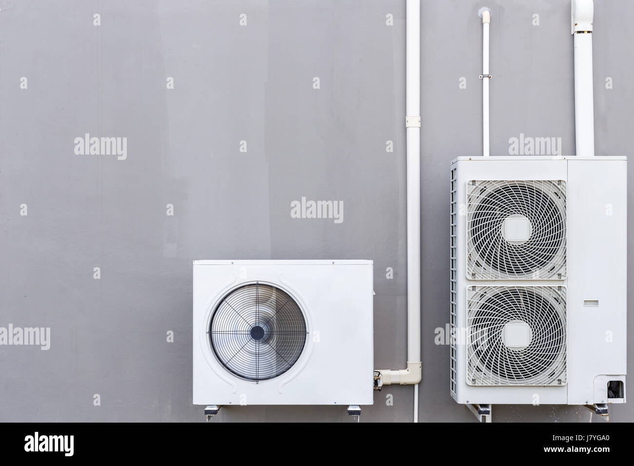 Outdoor air conditioning compressor installed the wall Stock Photo - Alamy