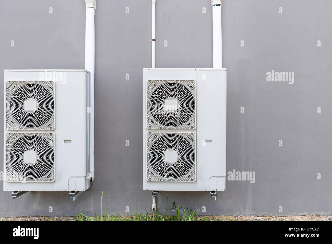 Outdoor air conditioning compressor installed the wall Stock Photo - Alamy