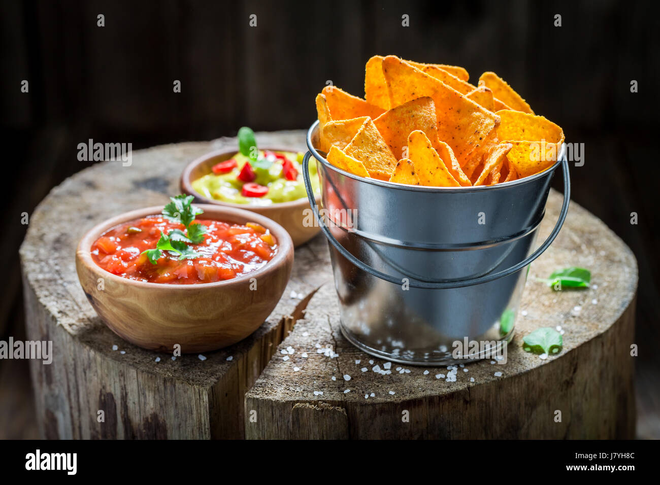 Delicious nachos with salt and spicy red sauce Stock Photo - Alamy