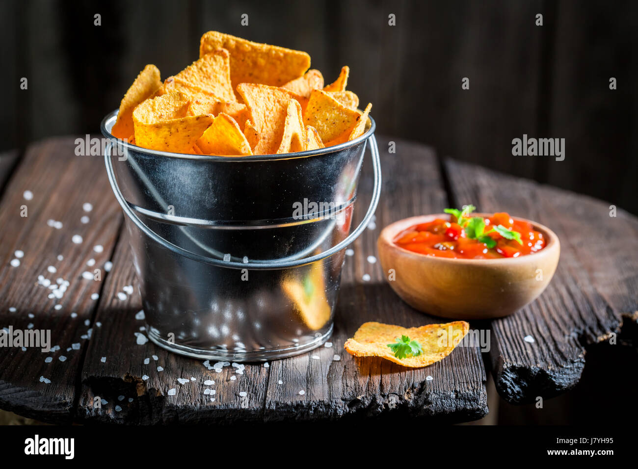 Mexican nachos with red pepper dip and salt Stock Photo - Alamy