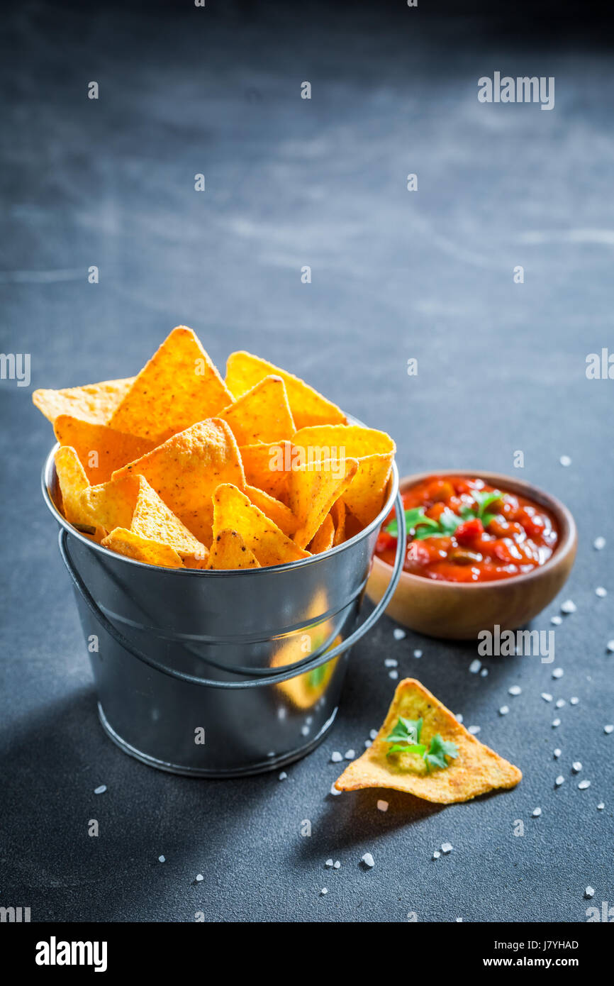 Golden nachos as a snack for a party Stock Photo - Alamy