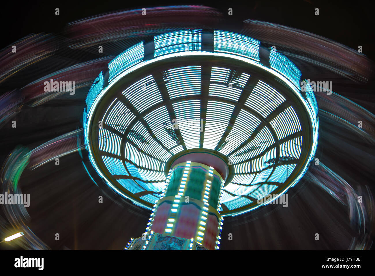 Long exposure shot of the popular Wave Swinger ride, with ghost trails ...