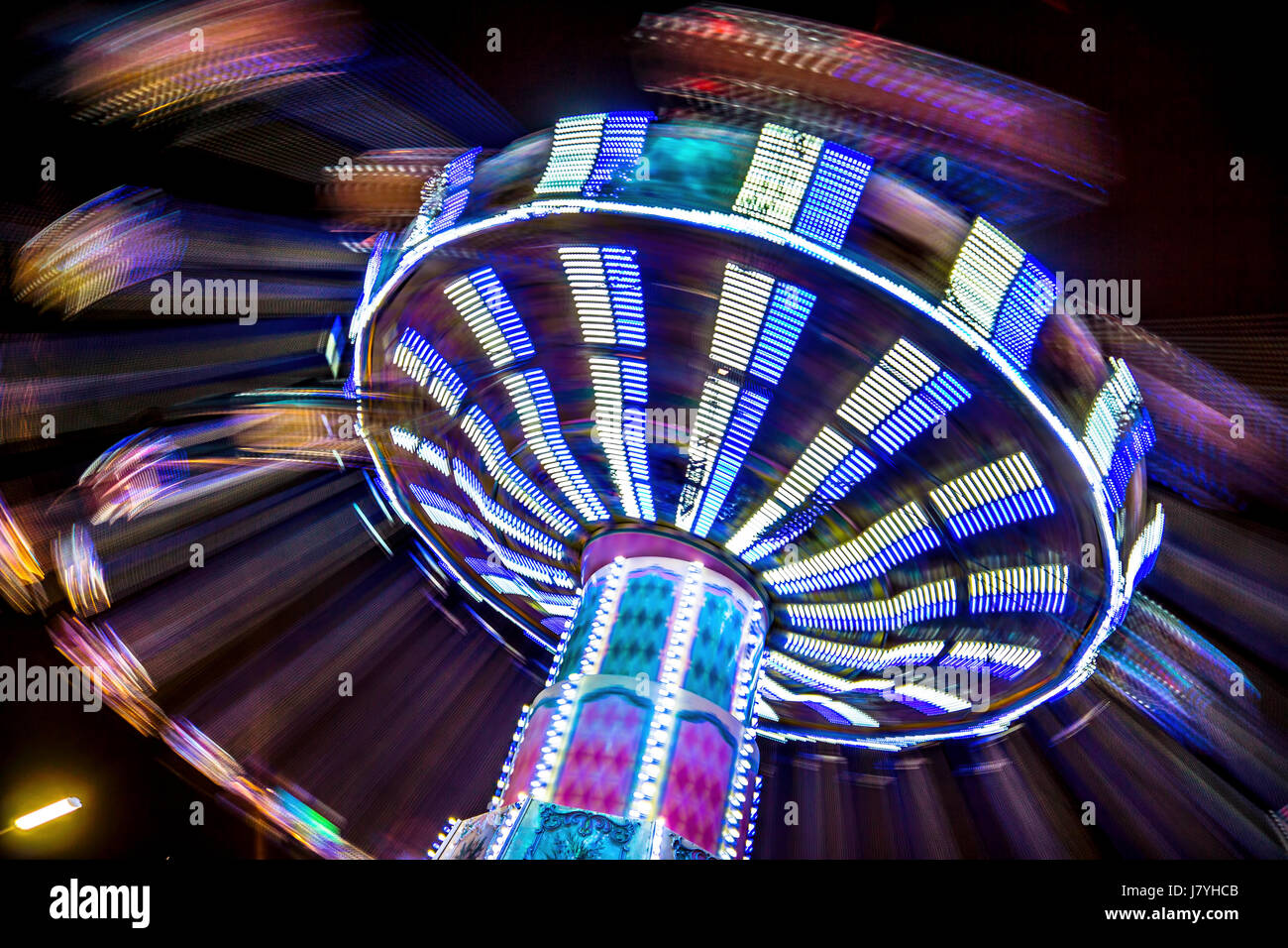 Long exposure shot of the popular Wave Swinger ride, with ghost trails ...