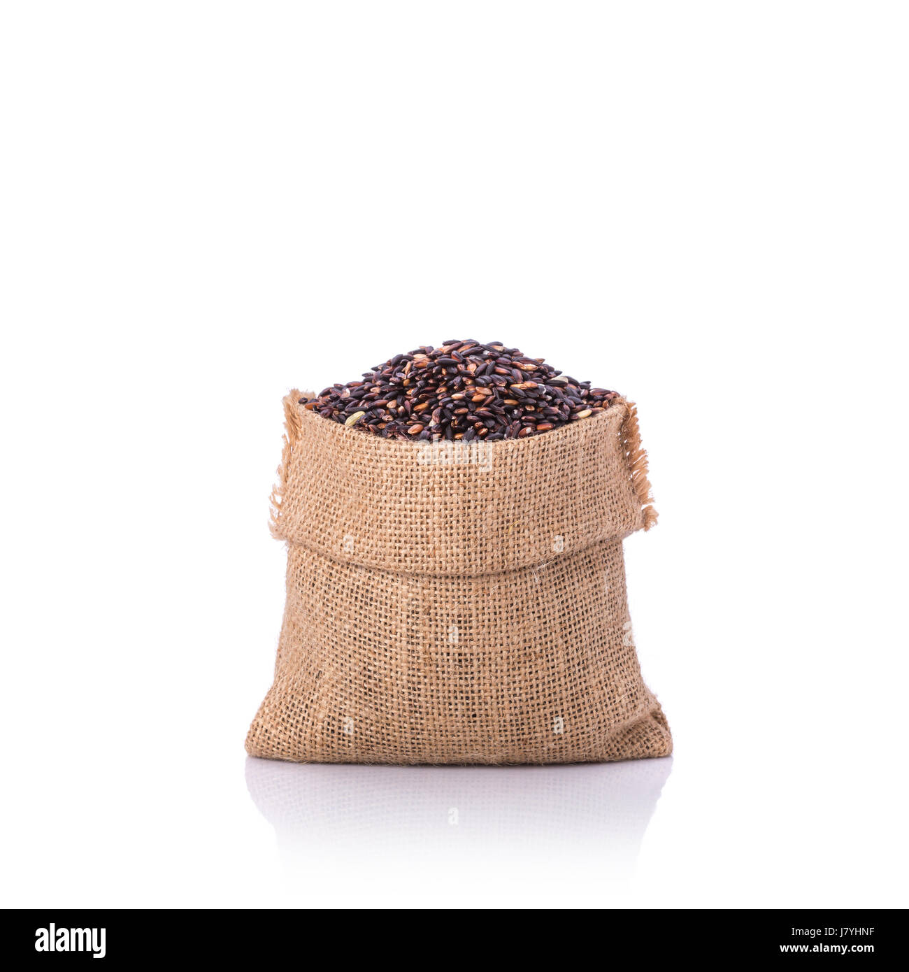 Close up Thai black sticky rice in small sack. Studio shot isolated on ...