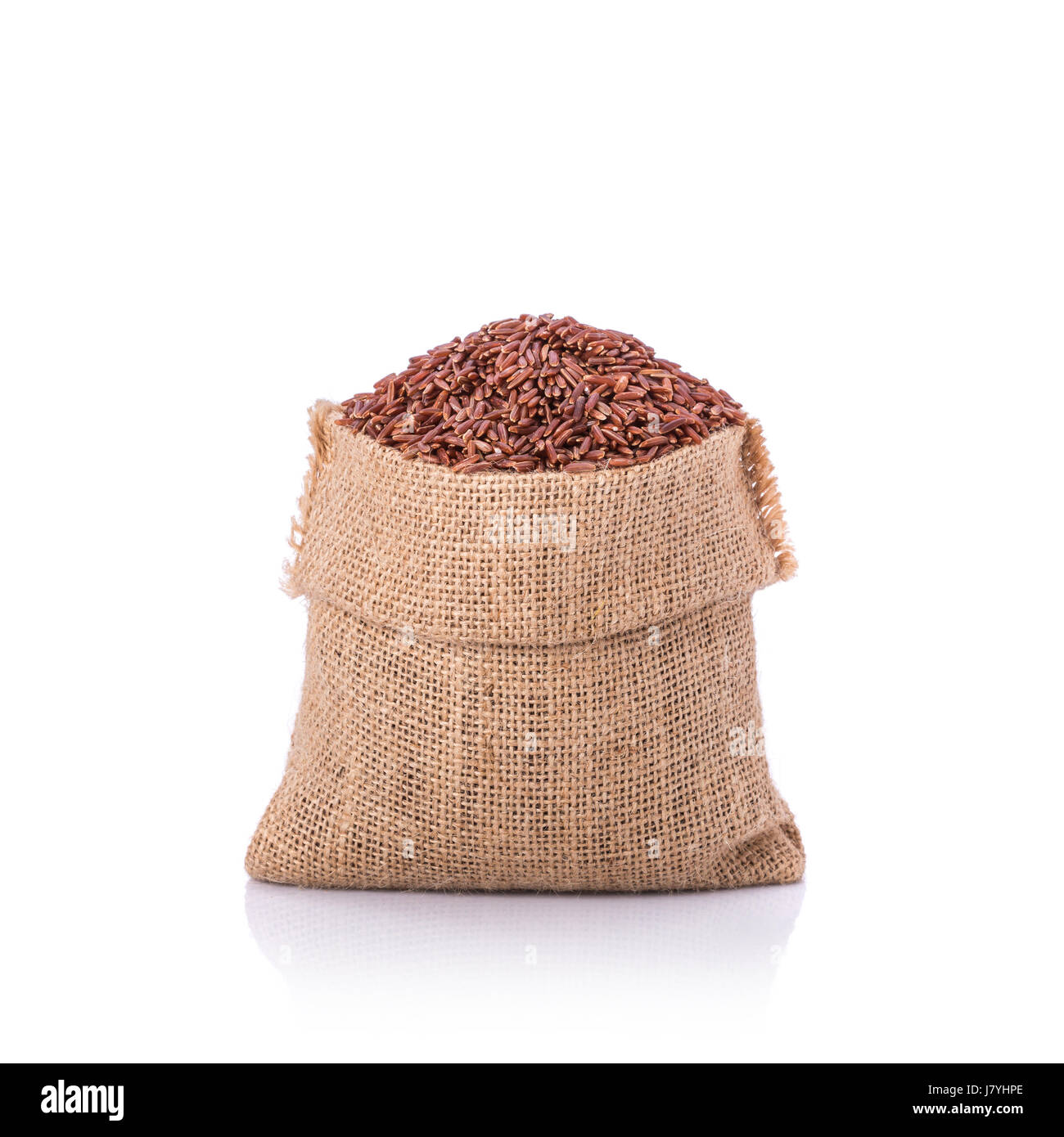 Close up Thai red jasmine rice in small sack. Studio shot isolated on ...