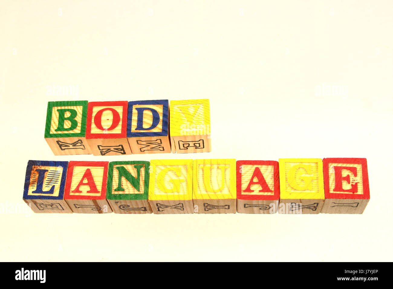 The term body language displayed visually using colorful wooden toy ...