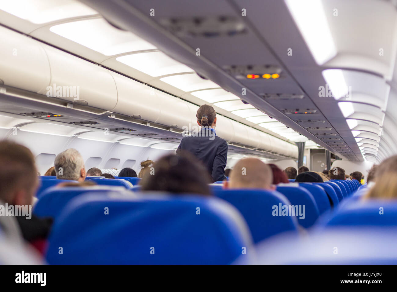 Plane aisle passenger hi-res stock photography and images - Alamy