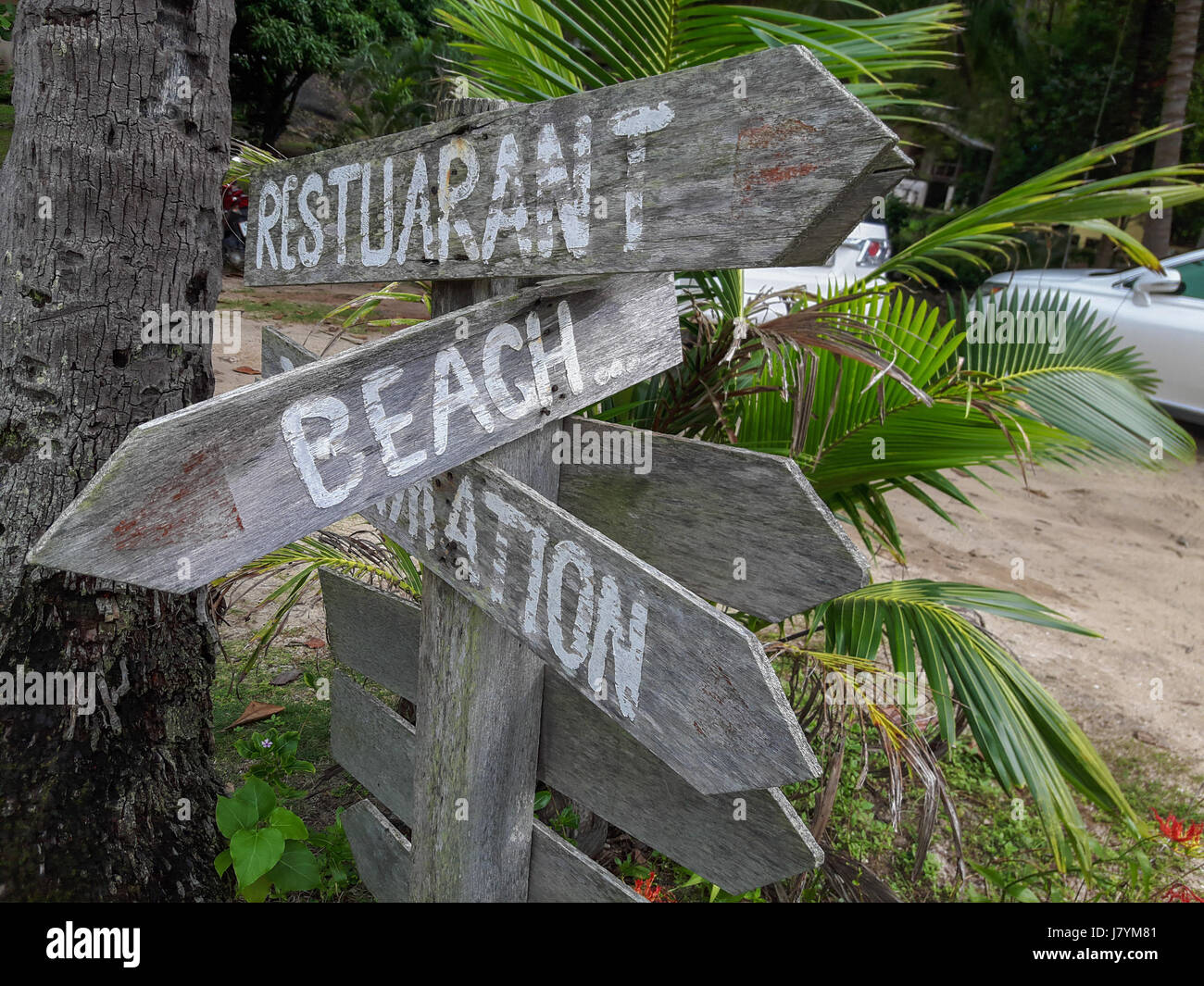 Wooden signboard on tropical beach Stock Photo - Alamy