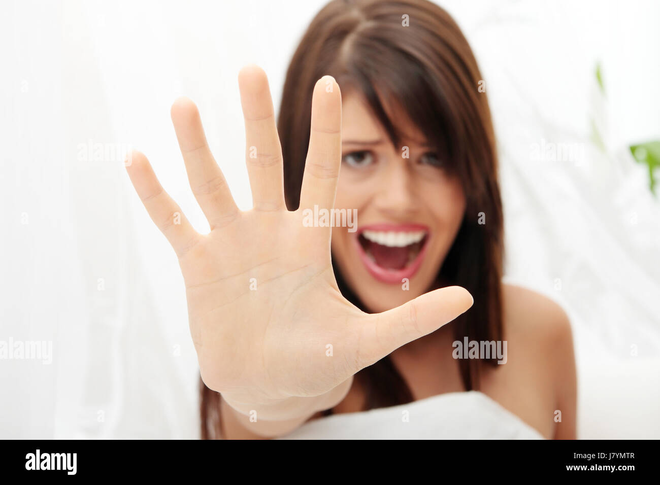 woman hand female fight fighting bed face panic fear adult hurt horror ...