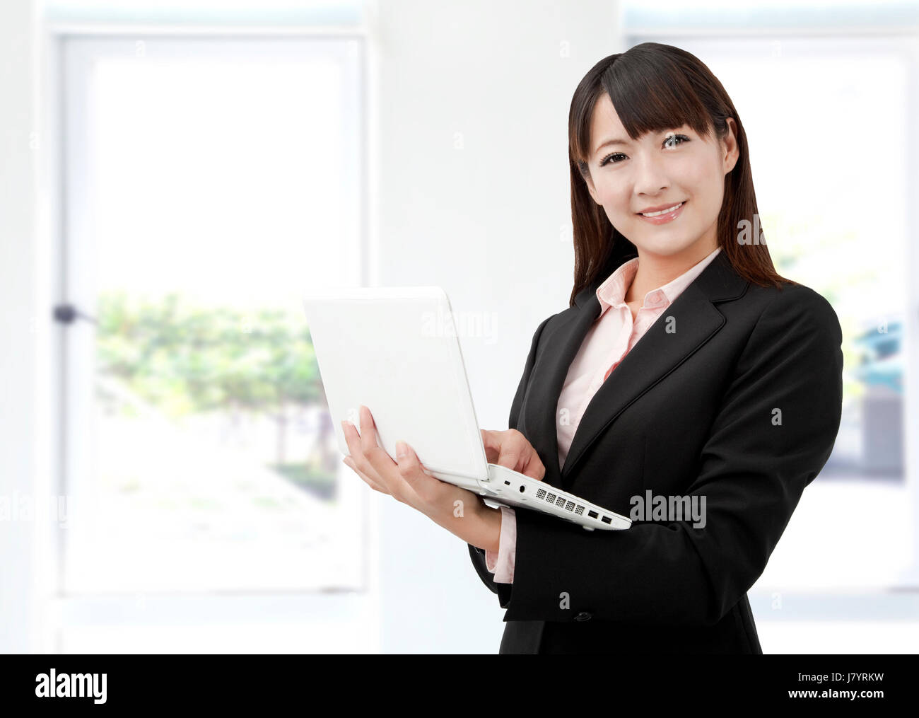woman office laptop notebook computers computer laugh laughs laughing ...