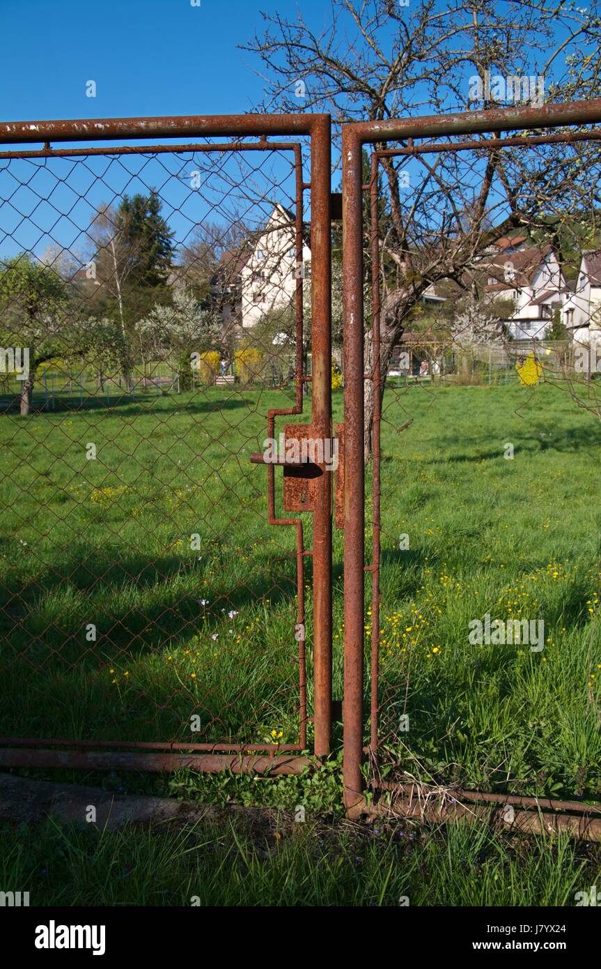 rusty gate to an old garden Stock Photo - Alamy