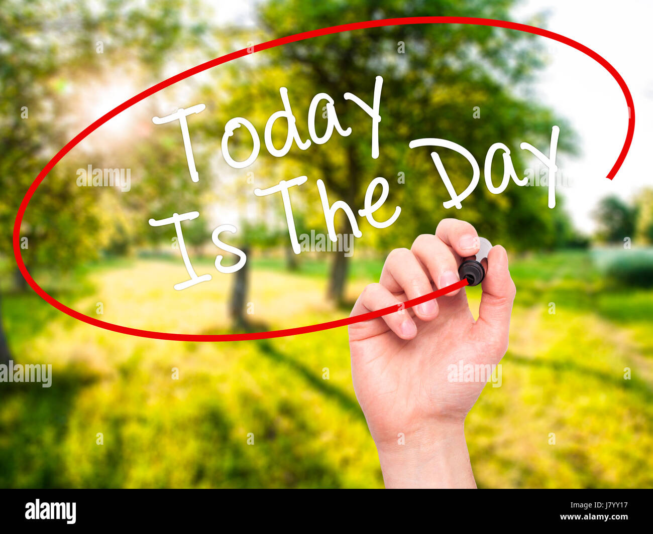 Man Hand writing Today Is The Day with black marker on visual screen ...