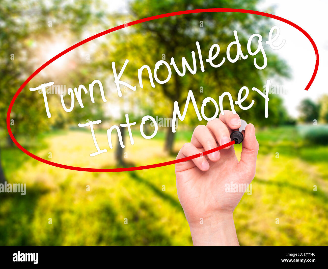 Man Hand writing Turn Knowledge Into Money with black marker on visual ...