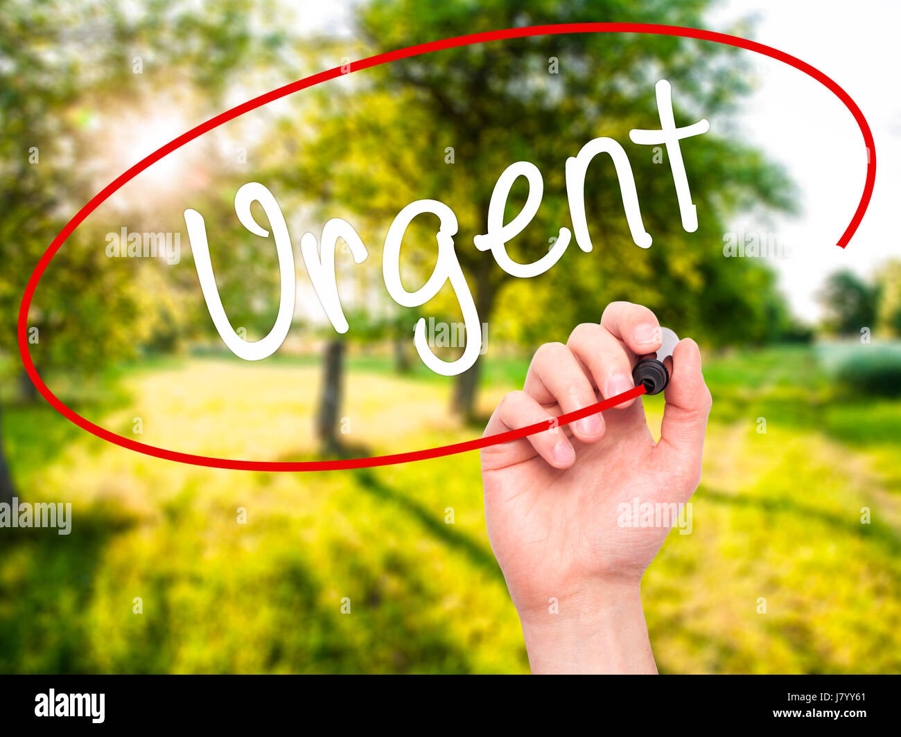 Man Hand writing Urgent with black marker on visual screen. Isolated on ...