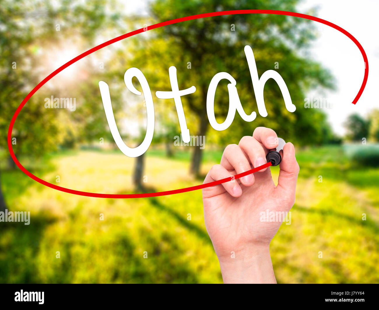 Man Hand writing Utah with black marker on visual screen. Isolated on ...