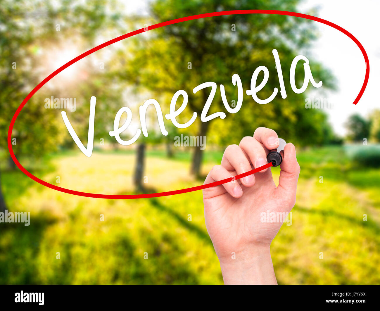 Man Hand writing Venezuela with black marker on visual screen. Isolated ...