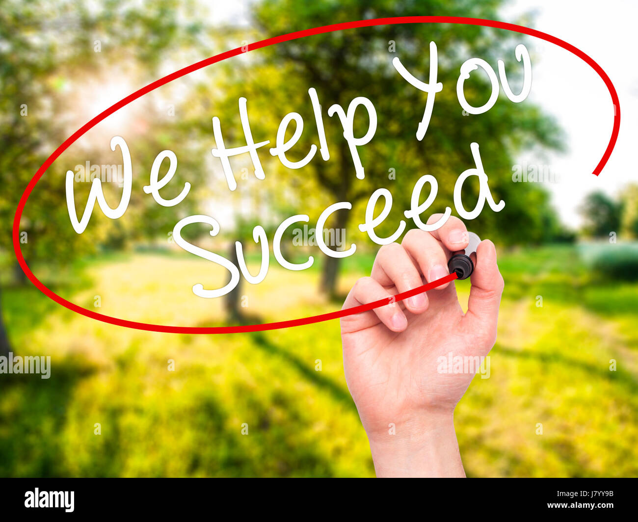 Man Hand writing We Help You Succeed with black marker on visual screen ...