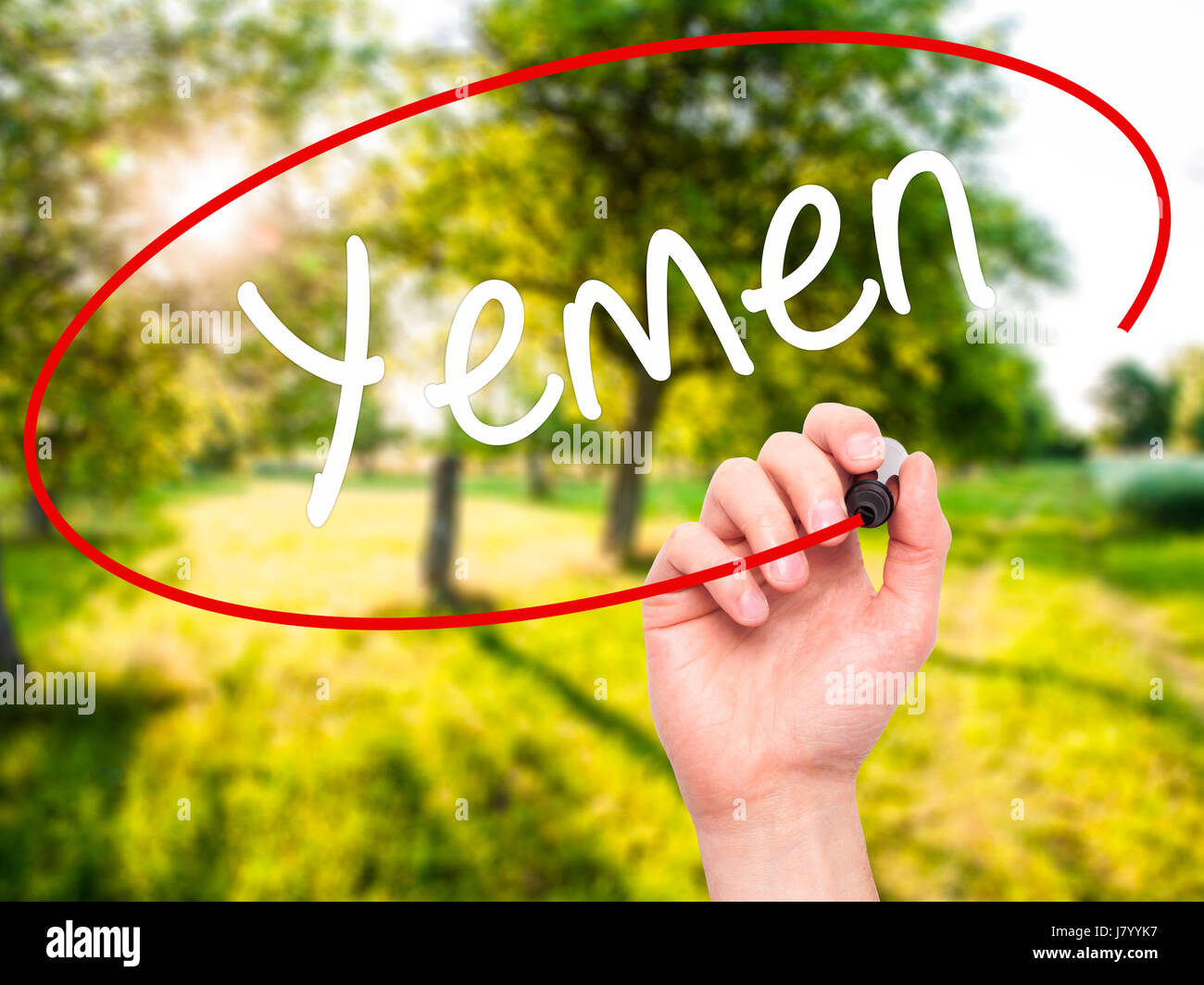 Man Hand writing Yemen with black marker on visual screen. Isolated on ...
