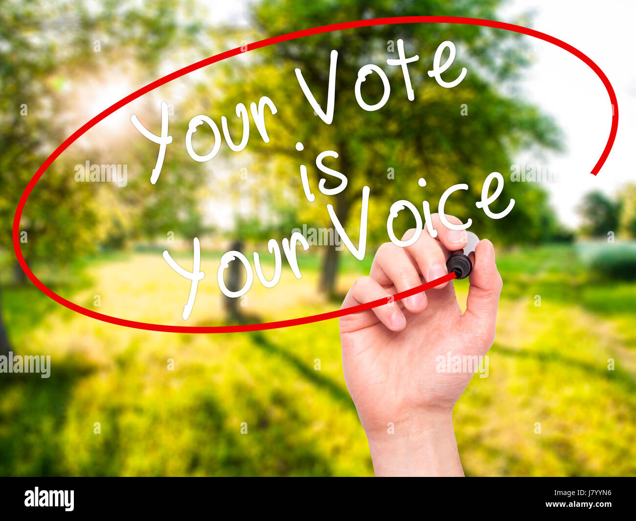 Man Hand writing Your Vote is Your Voice with black marker on visual ...