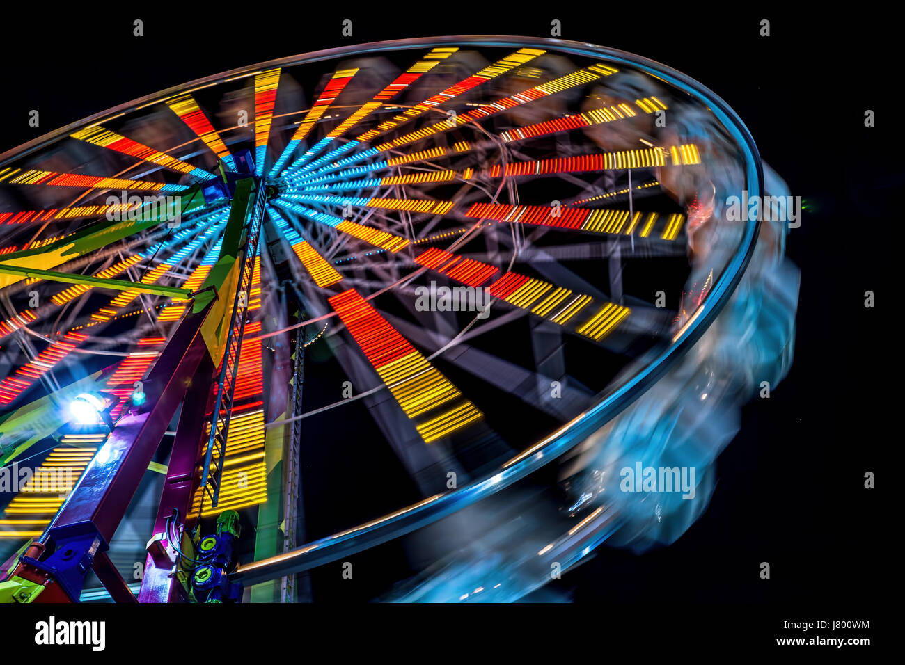 The beautiful Grand Wheel- spinning in blue, orange and yellow at the ...