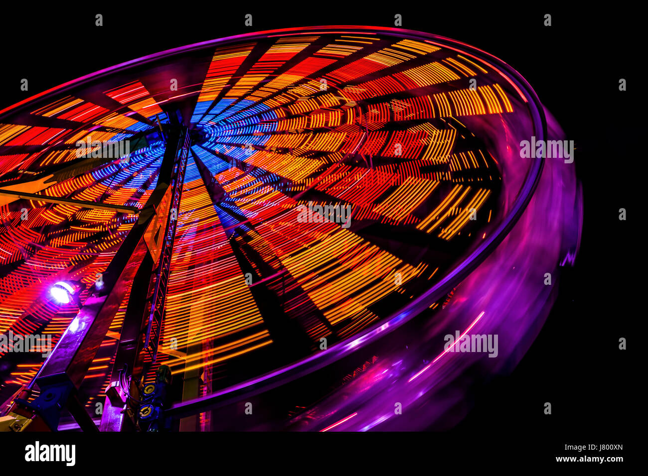 The beautiful Grand Wheel- spinning in blue, orange and yellow at the ...
