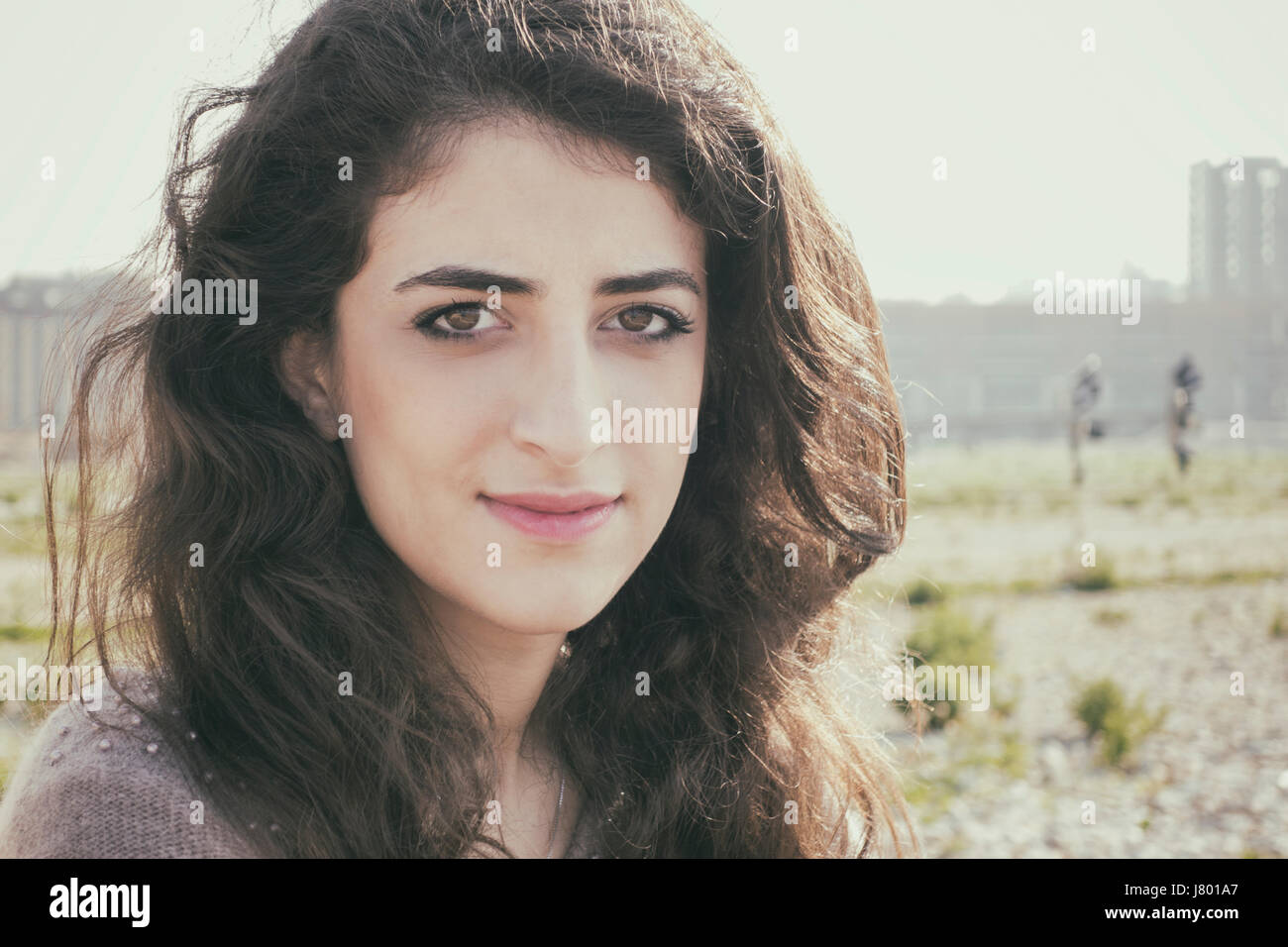 Beautiful young Lebanese woman outdoors smiling Stock Photo - Alamy