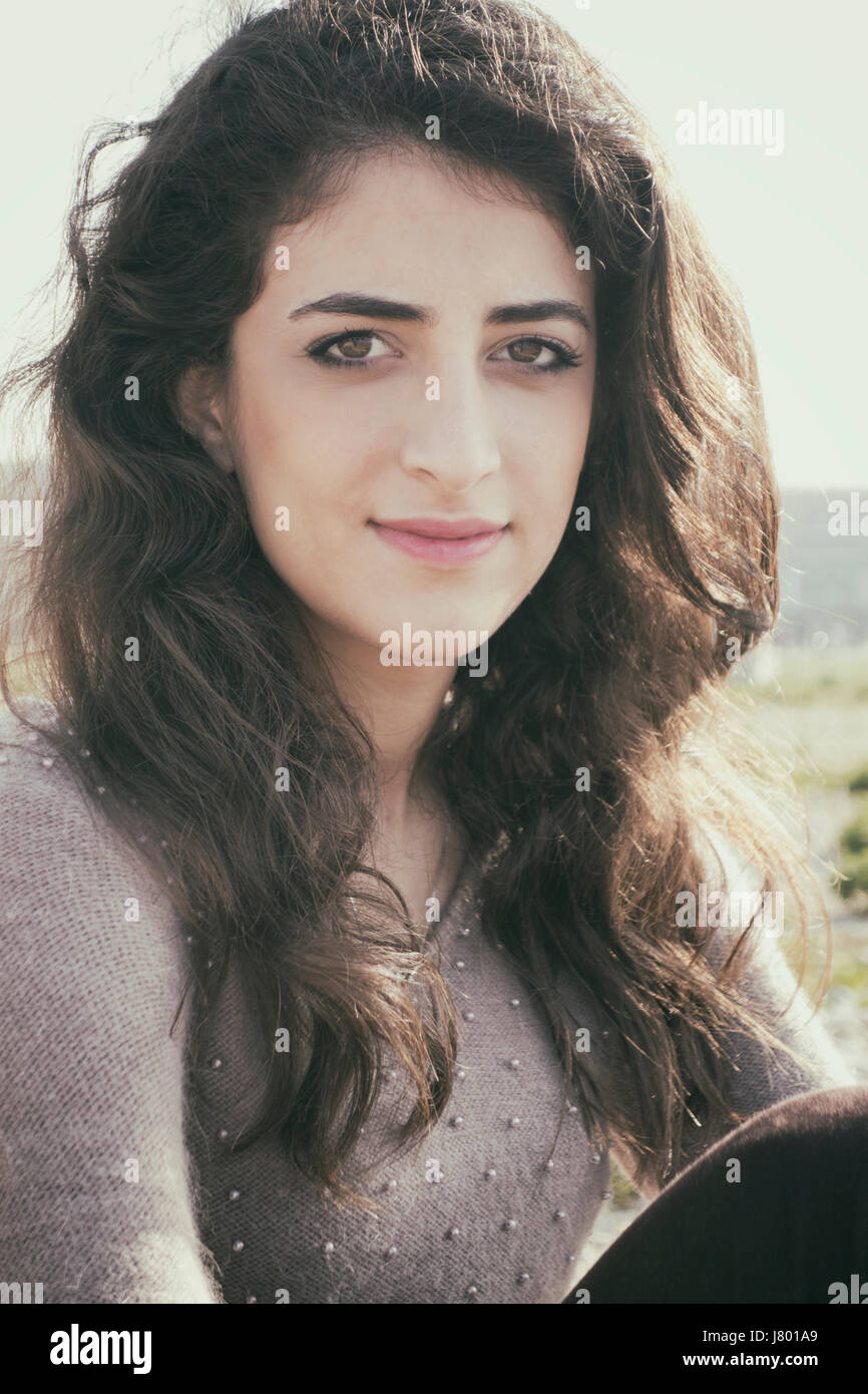 Beautiful young Lebanese woman outdoors smiling Stock Photo - Alamy