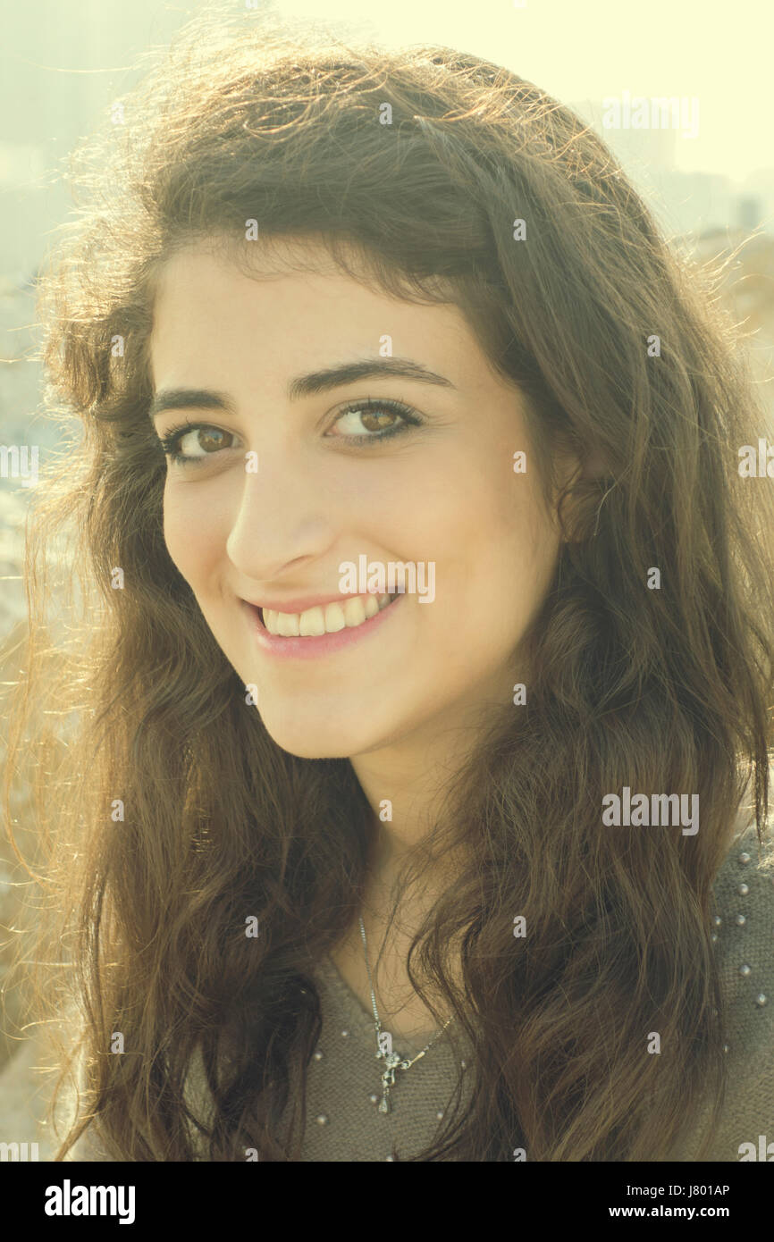 Beautiful young Lebanese woman outdoors smiling Stock Photo - Alamy