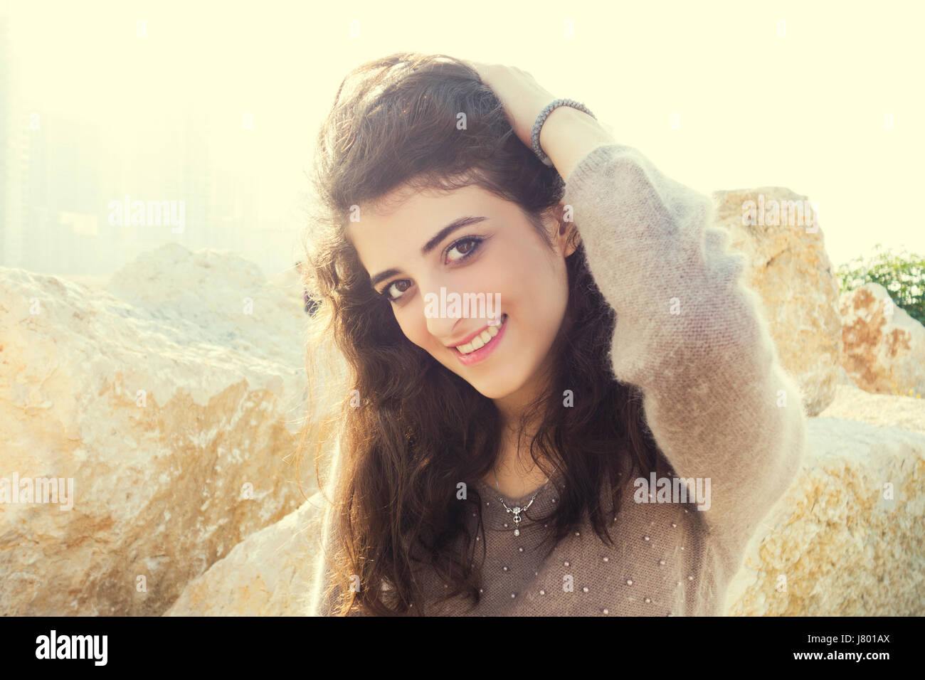 Beautiful young Lebanese woman outdoors smiling Stock Photo - Alamy