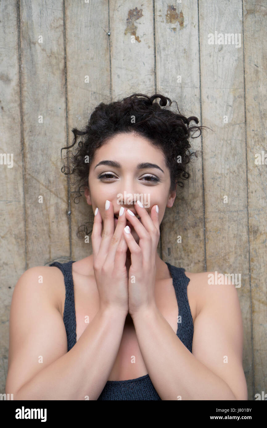 Covering mouth laughing hi-res stock photography and images - Alamy