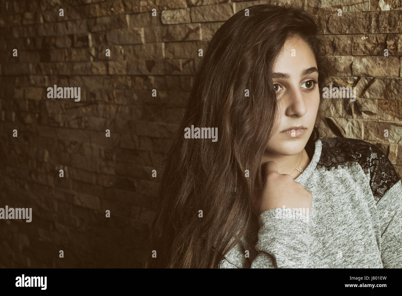 Pensive teen girl looking away Stock Photo - Alamy