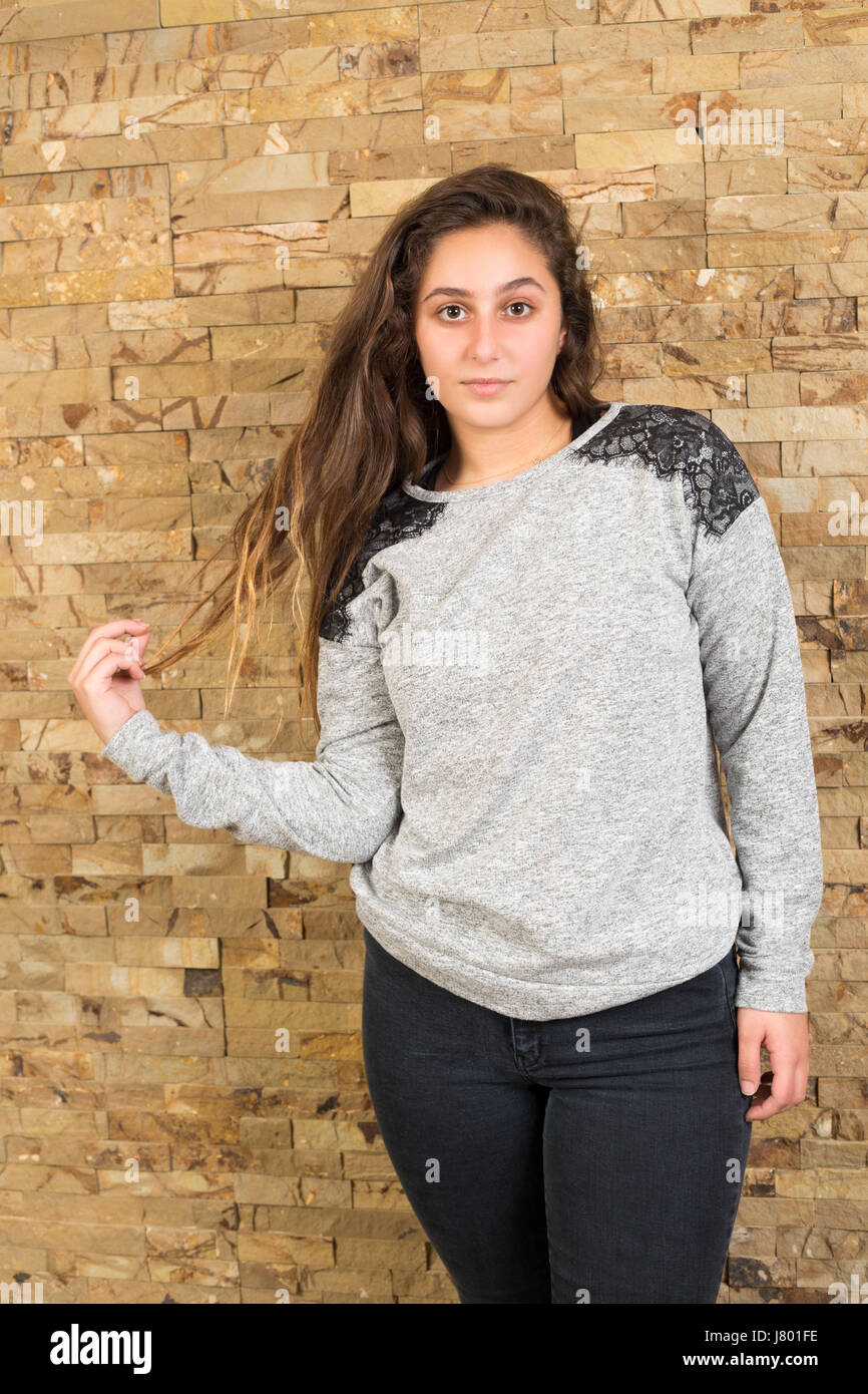 Beautiful teenage girl hand holding long hair Stock Photo - Alamy