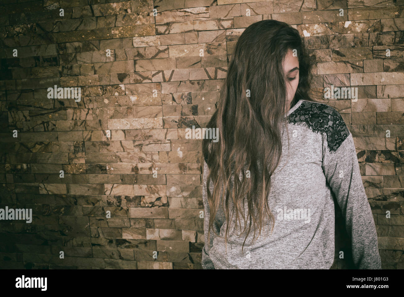 Sad teenage girl hair covering face Stock Photo - Alamy