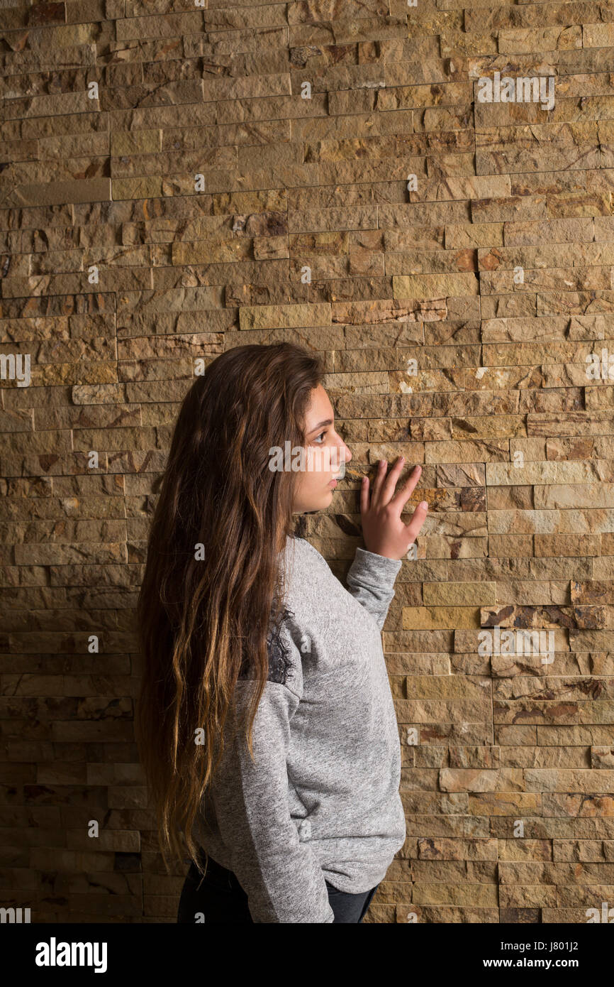 Serious teen girl looking away Stock Photo - Alamy